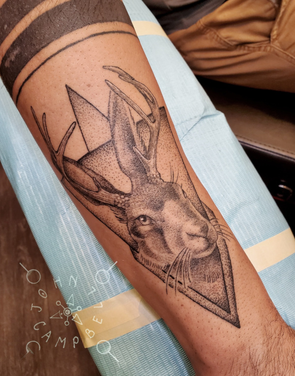Black and grey tattoo of a Rabbit with antlers by John Campbell at ...