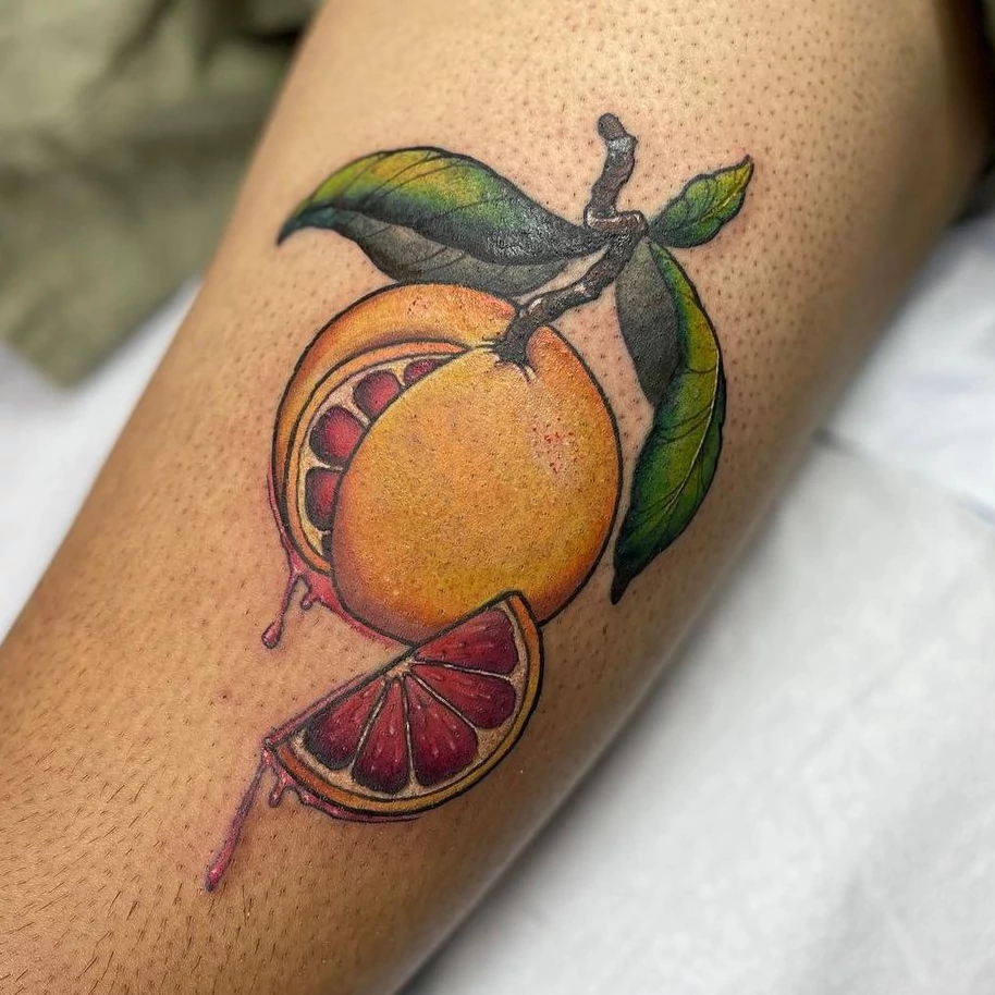 Color stylized upper thigh tattoo of a blood orange by tattoo artist ...